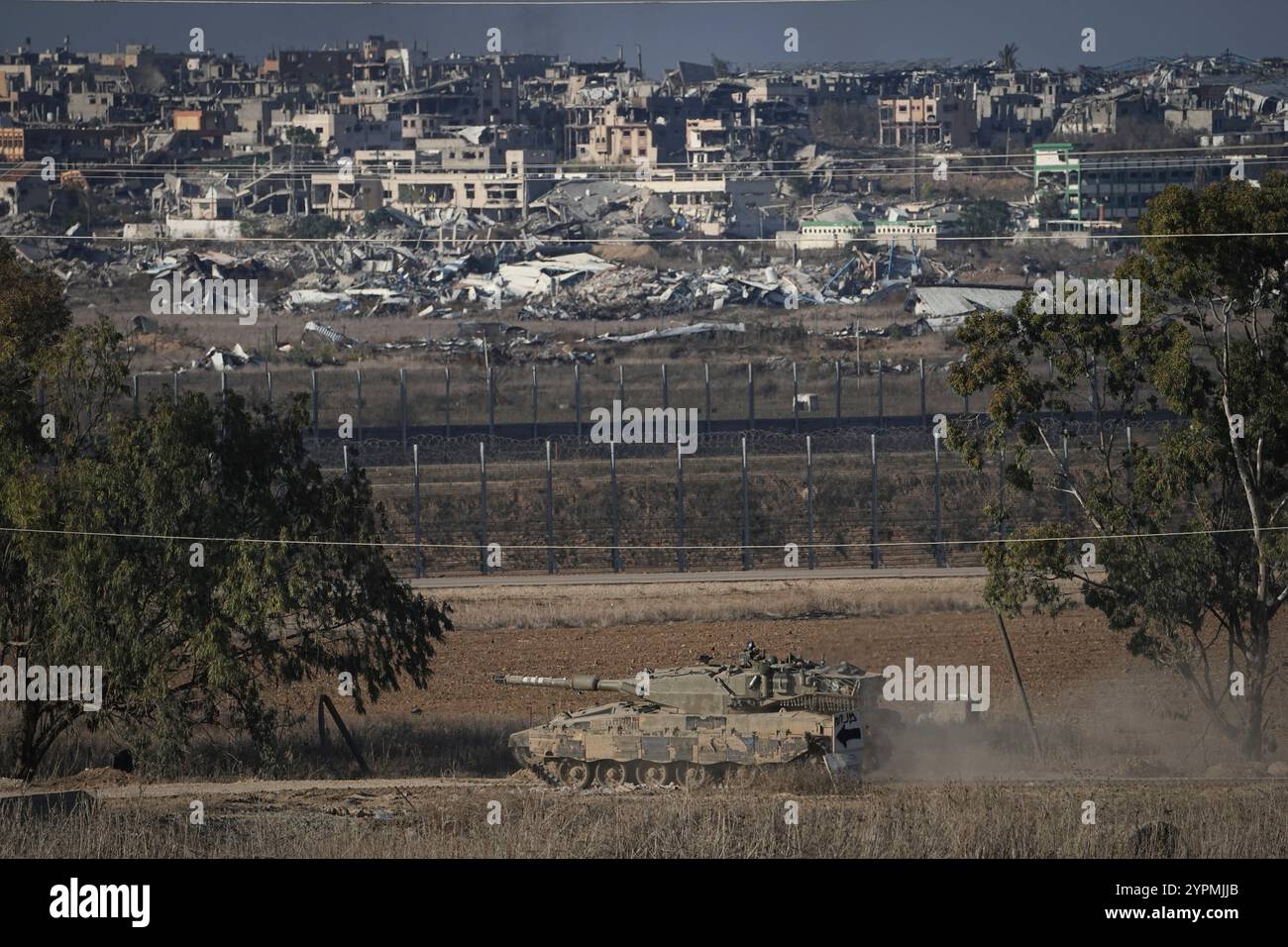 An Israeli armoured vehicle transits around the Israel-Gaza border, as ...