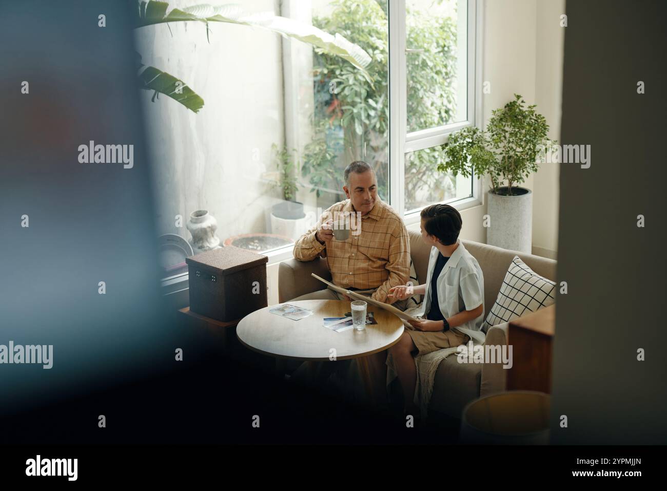 Granddad Spending Time At Home With Grandson Stock Photo - Alamy