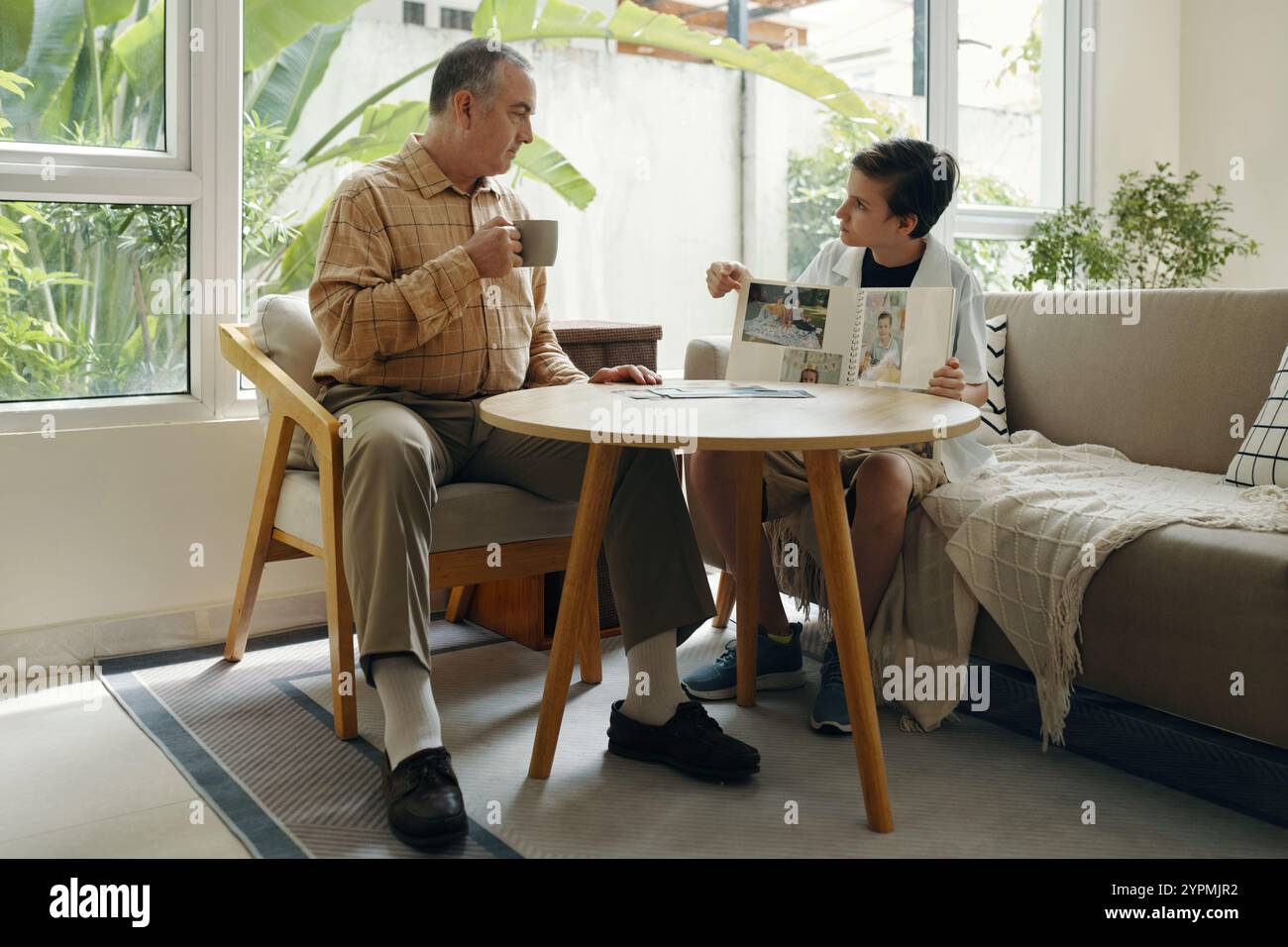 Granddad Spending Time With Grandchild At Home Stock Photo - Alamy