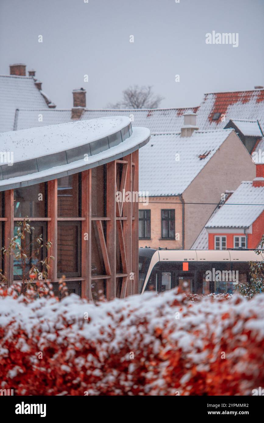 Snowy rooftops of traditional Danish buildings near Hans Christian Andersen's museum and ...