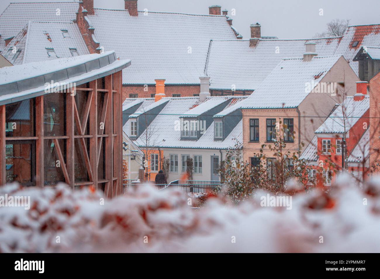 Snowy rooftops of traditional Danish buildings near Hans Christian Andersen's museum and ...