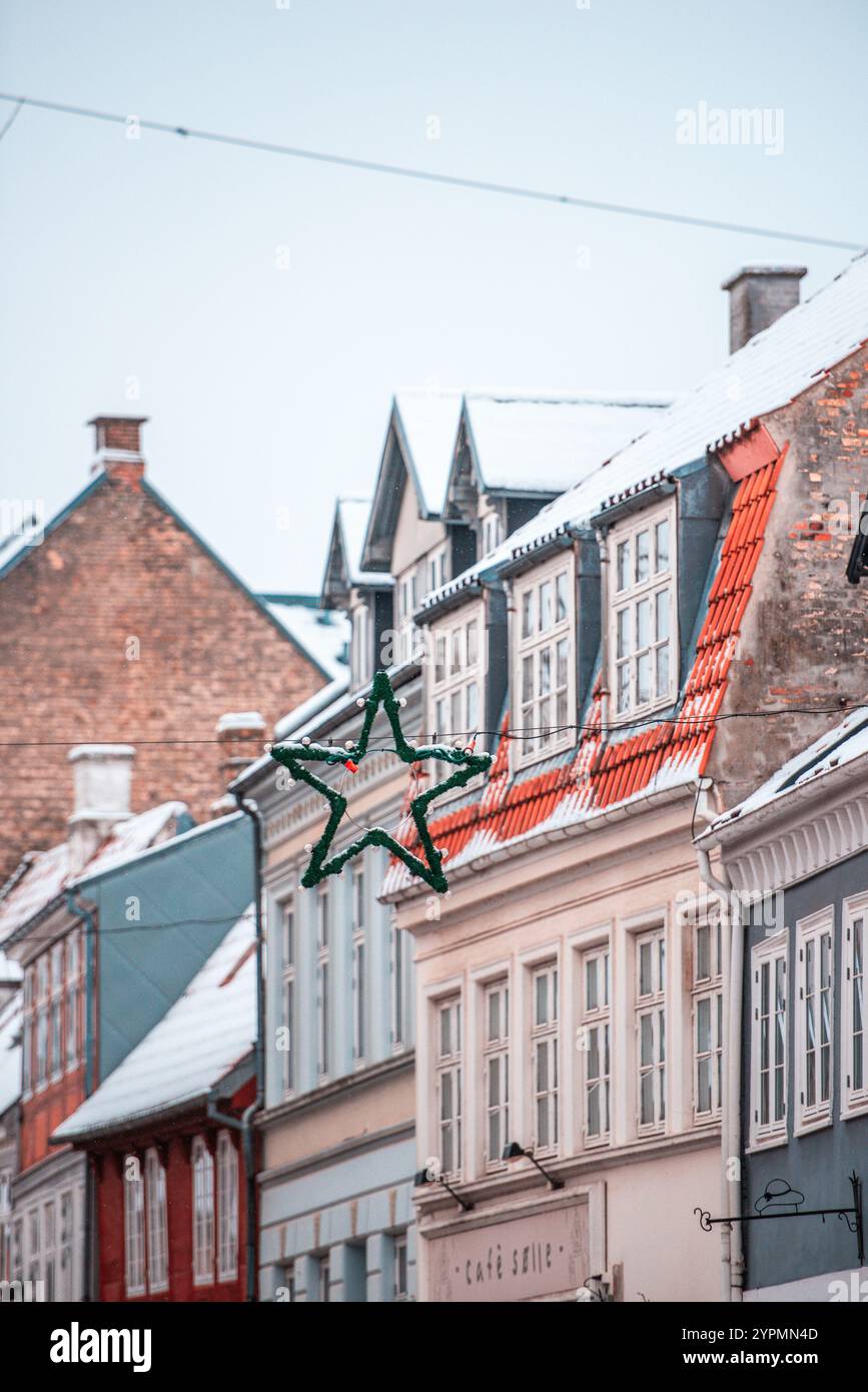 Snow-covered Scandinavian streets in Odense, Denmark, featuring ...