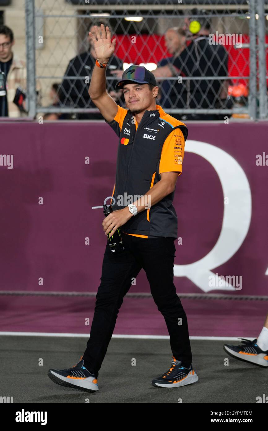 McLaren driver Lando Norris of Britain greets supporters before the ...