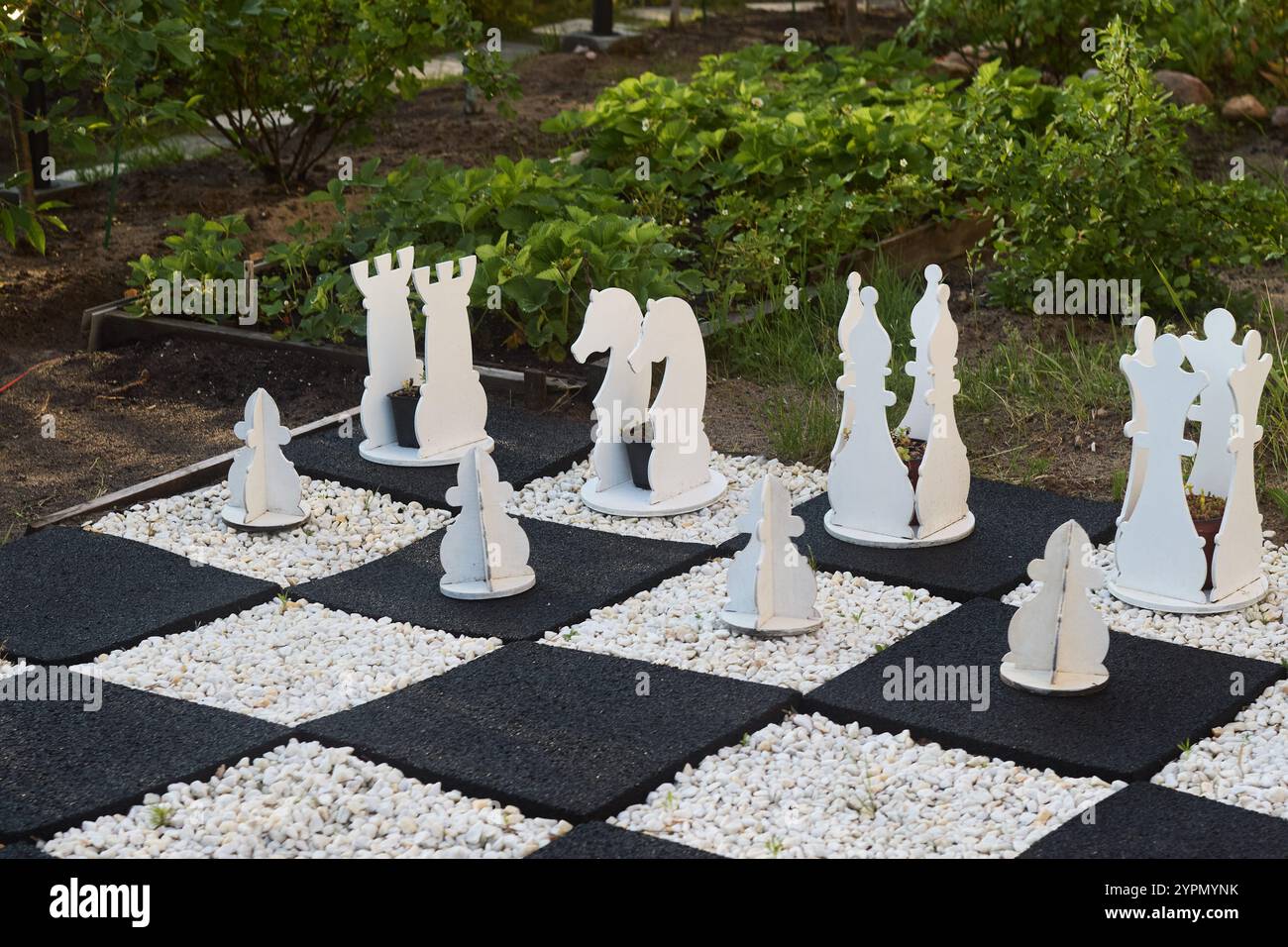 An impressive Outdoor Chess Set with Large White Pieces arranged ...