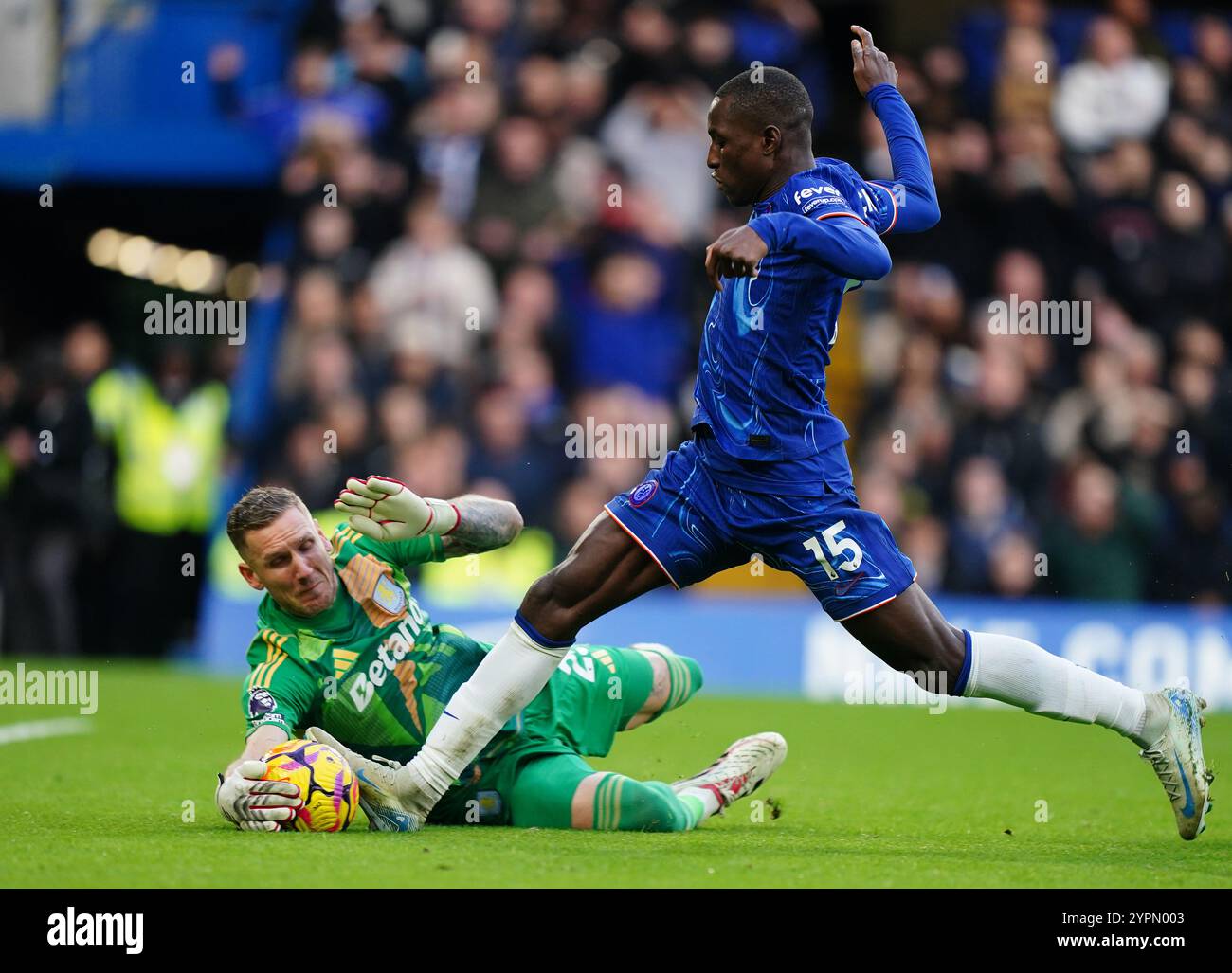 Aston Villa goalkeeper Robin Olsen saves at the feet of Chelsea's ...