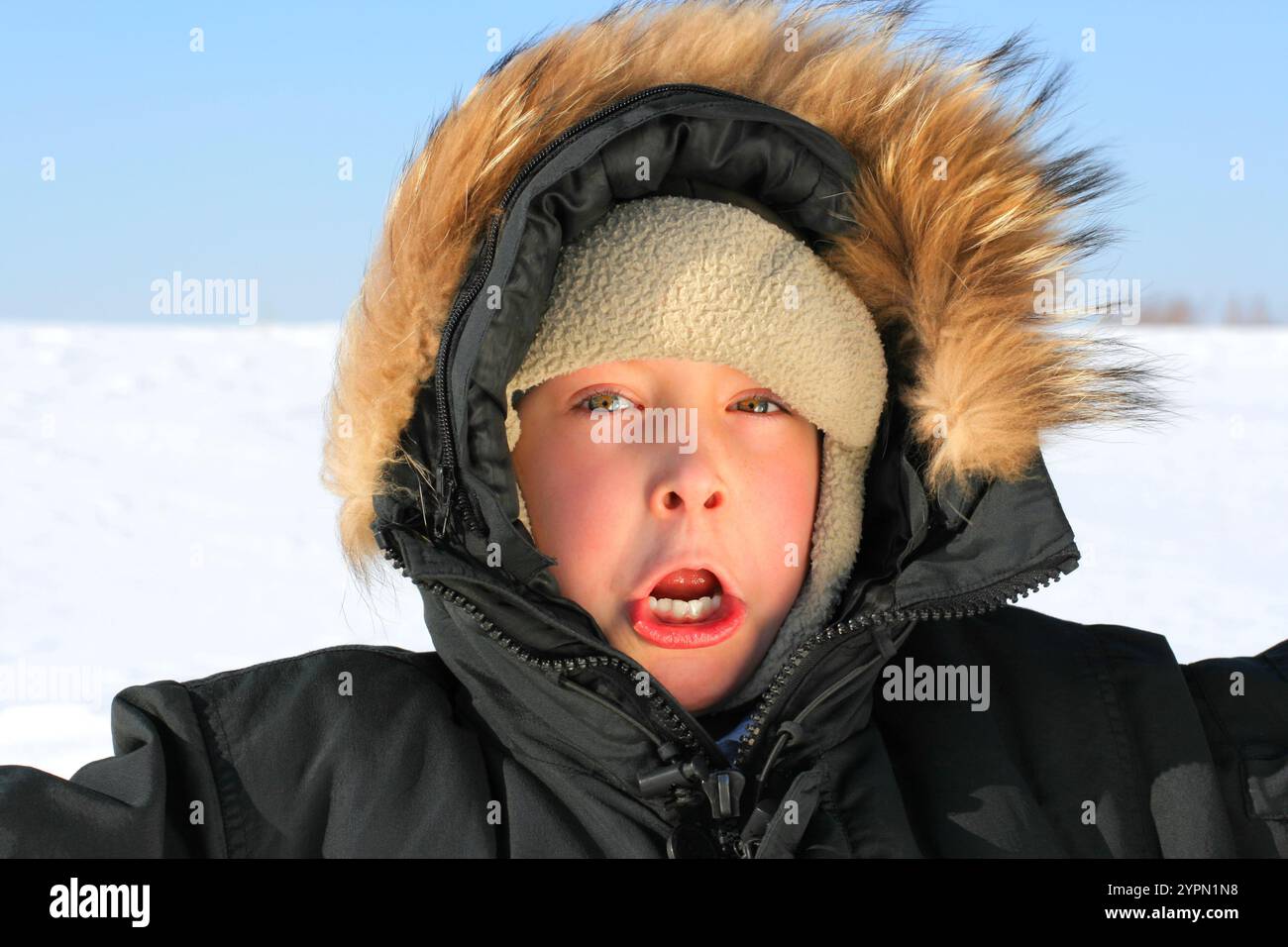 frozen kid on the hard frost Stock Photo - Alamy