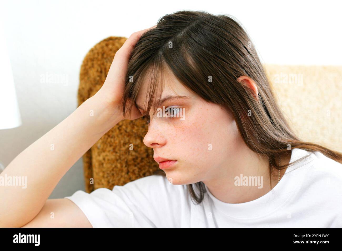 sad teenage girl in home interior Stock Photo - Alamy