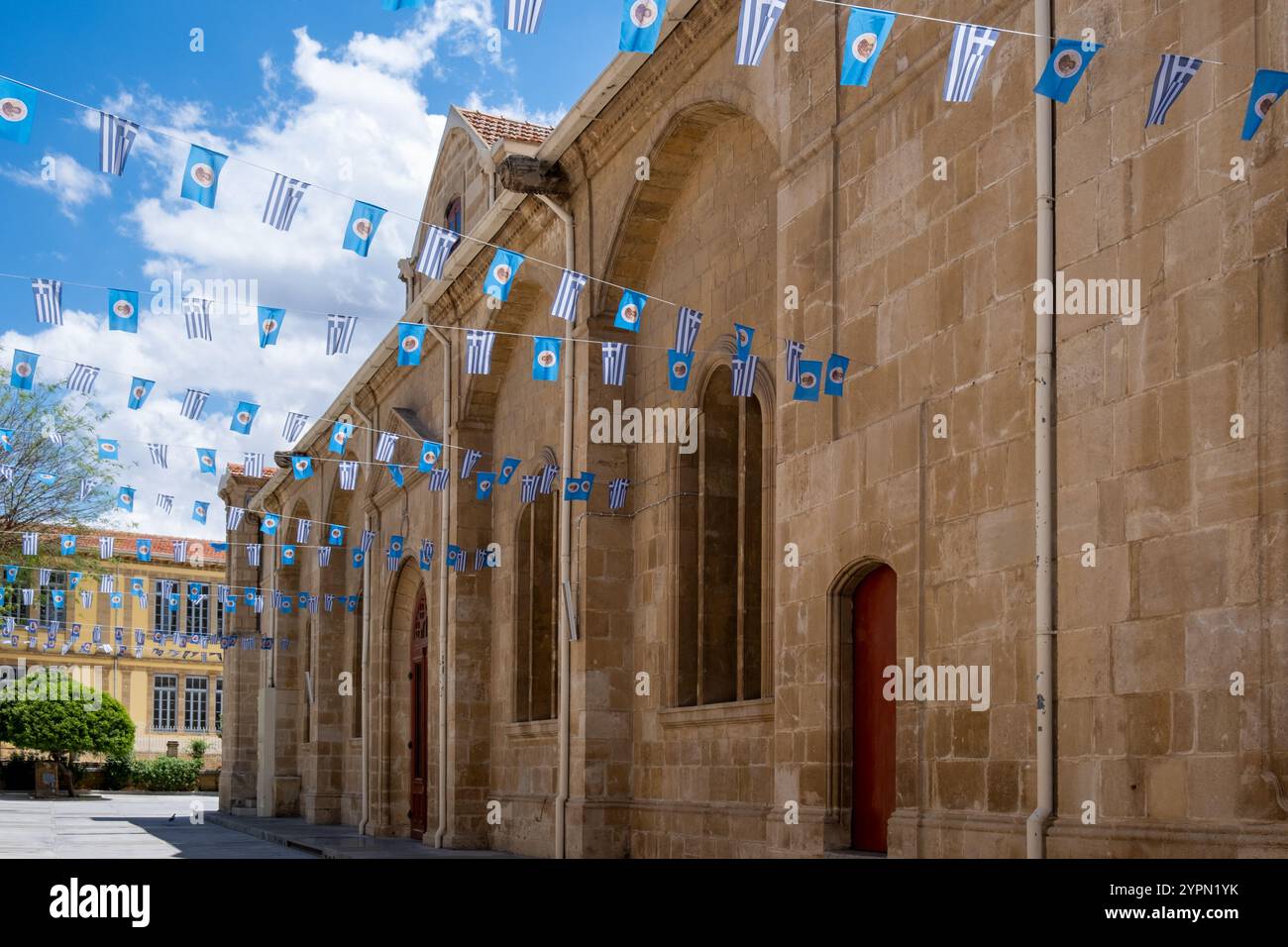 Greek flags hanging on christian church facade for independence day ...