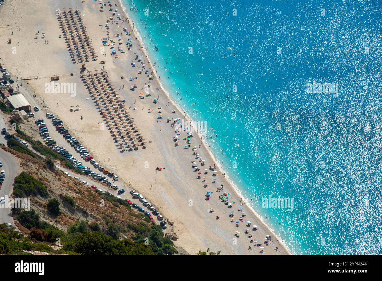 Tropical beach view with crystal clear water with tourist people on the ...
