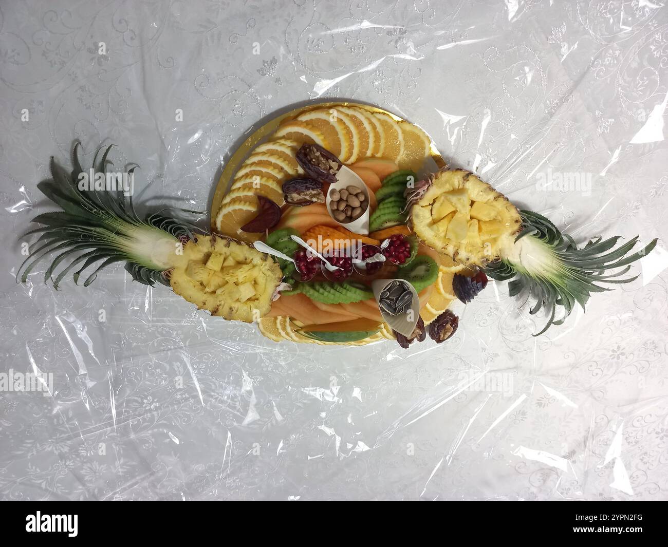 Fruit platter in the form of a pineapple and other fruits Stock Photo ...