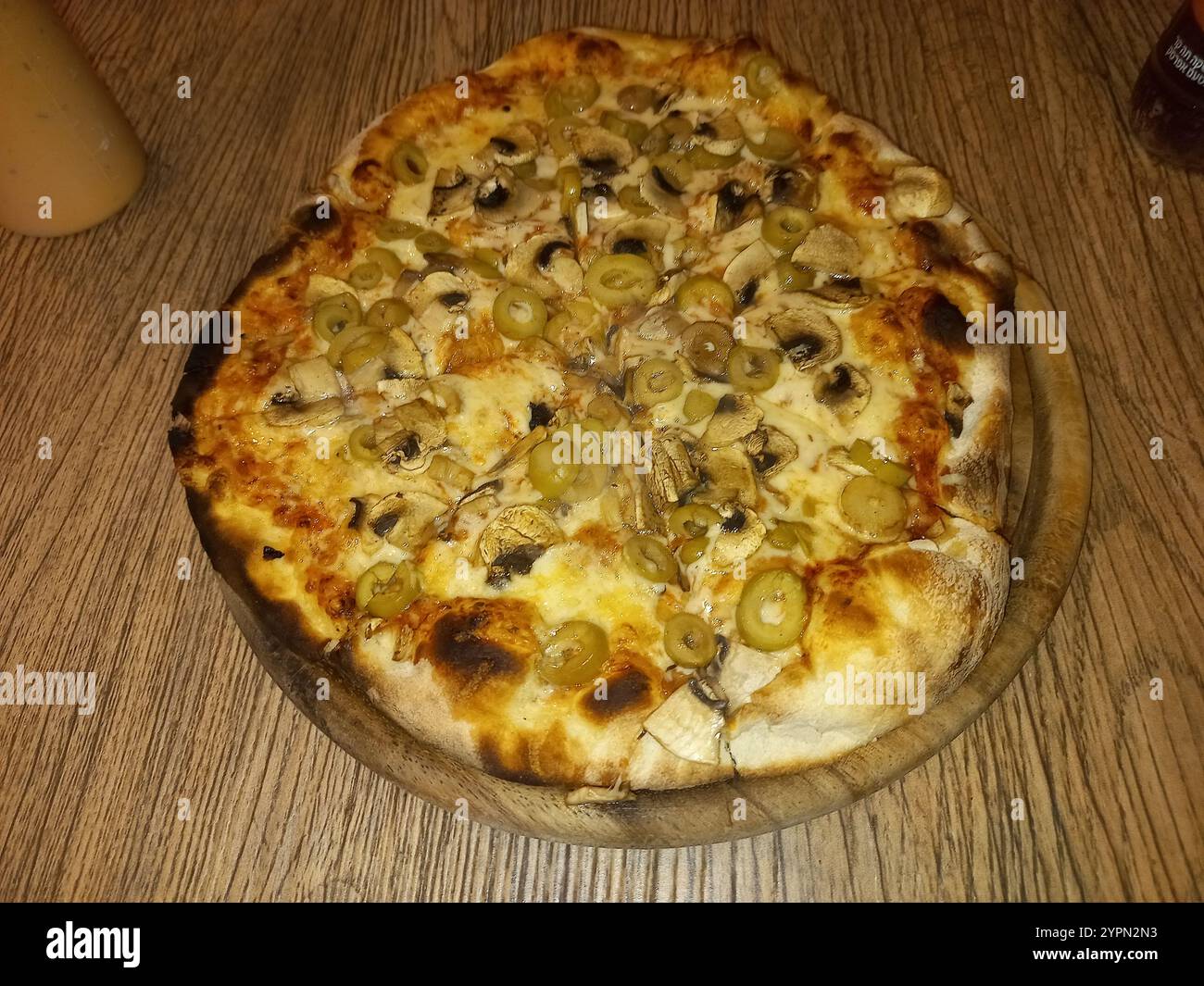 Pizza with yellow cheese and toppings on vegetables on the pizza Stock ...