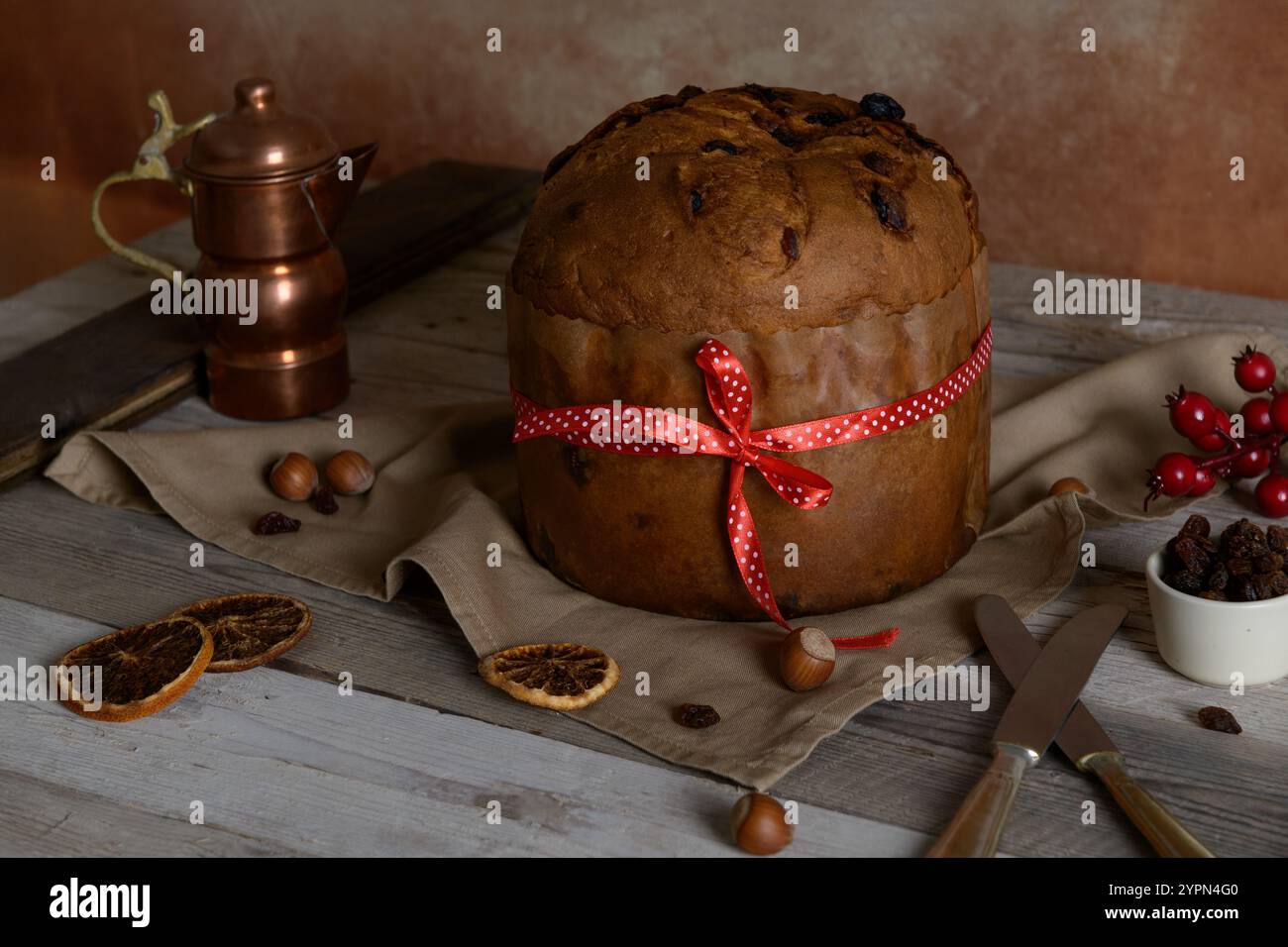 Traditional Italian Christmas Cake Panettone with red bow on wooden ...