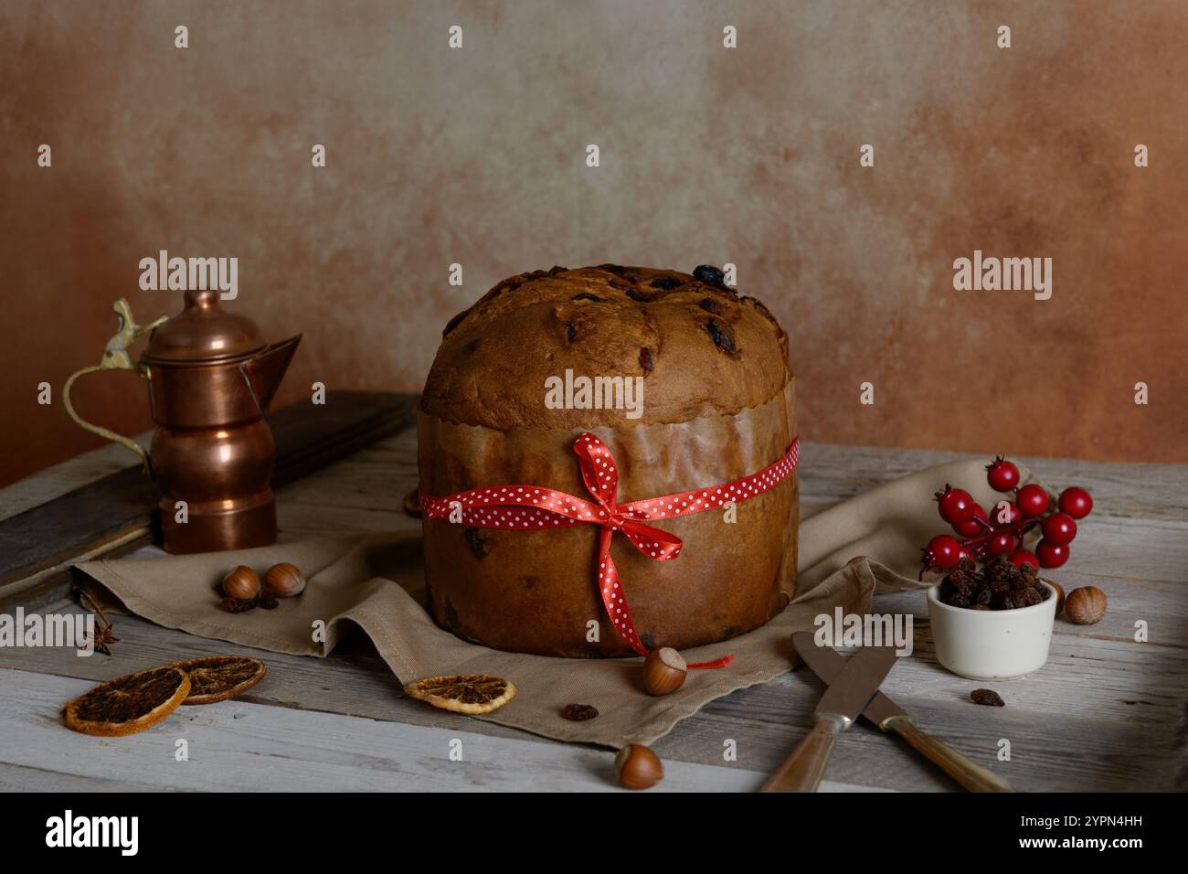 Traditional Italian Christmas Cake Panettone with red bow on wooden ...