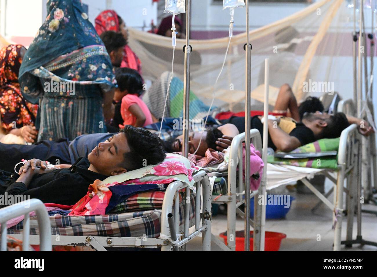 Patients suffering from dengue fever receive treatment inside the ...