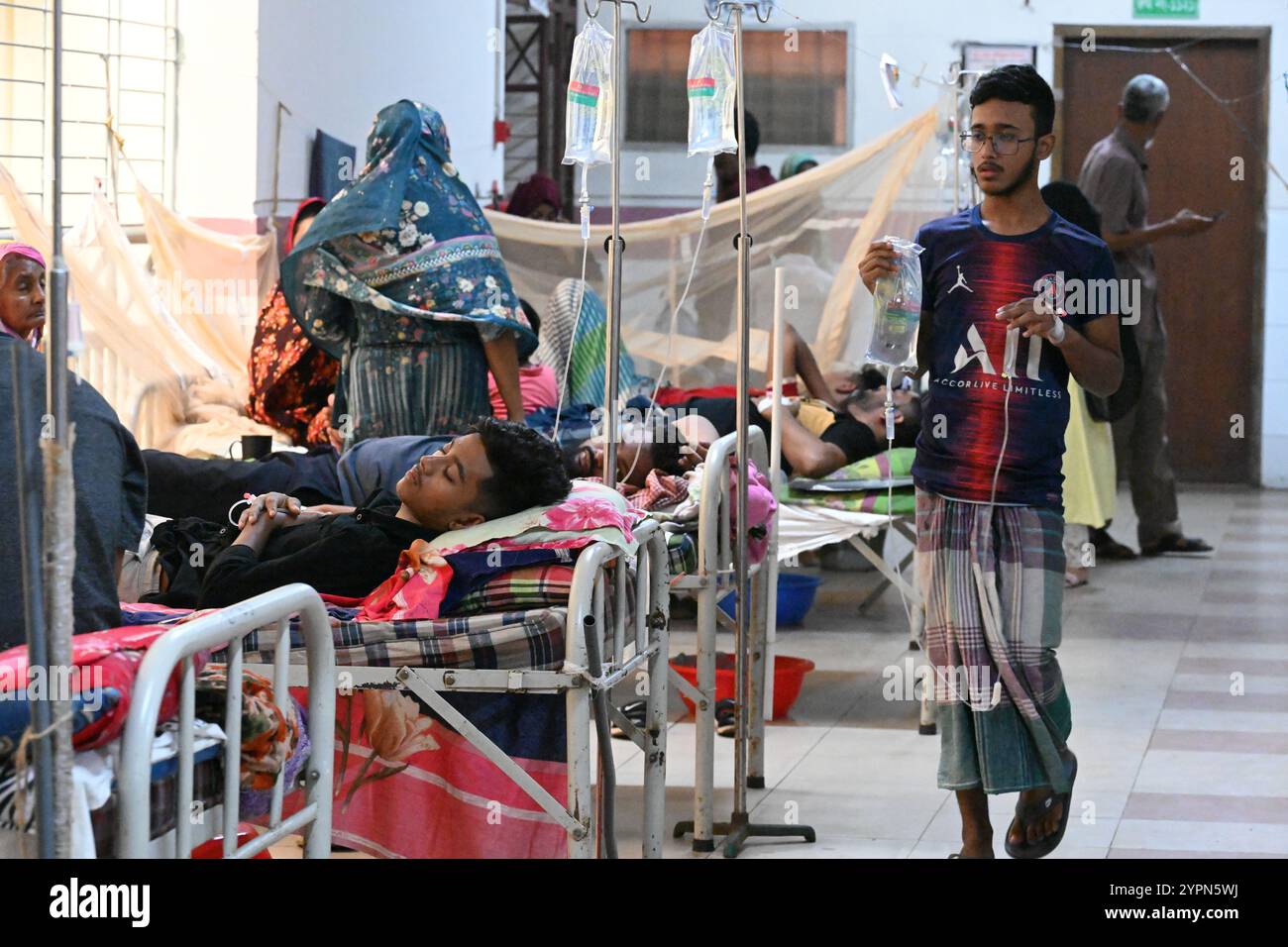 Patients suffering from dengue fever receive treatment inside the ...