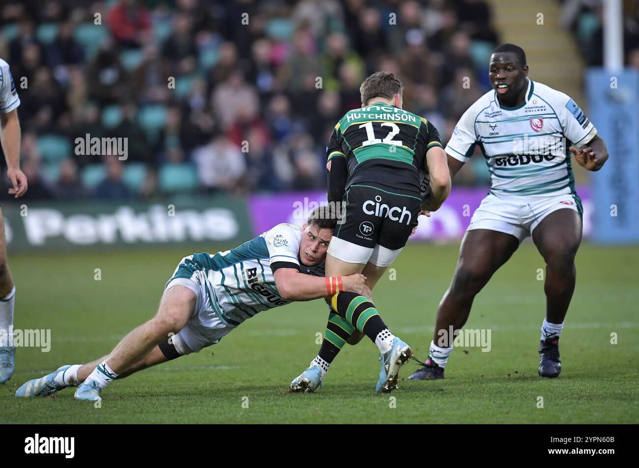 Seb Atkinson of Gloucester tackles Rory Hutchinson of Northampton ...
