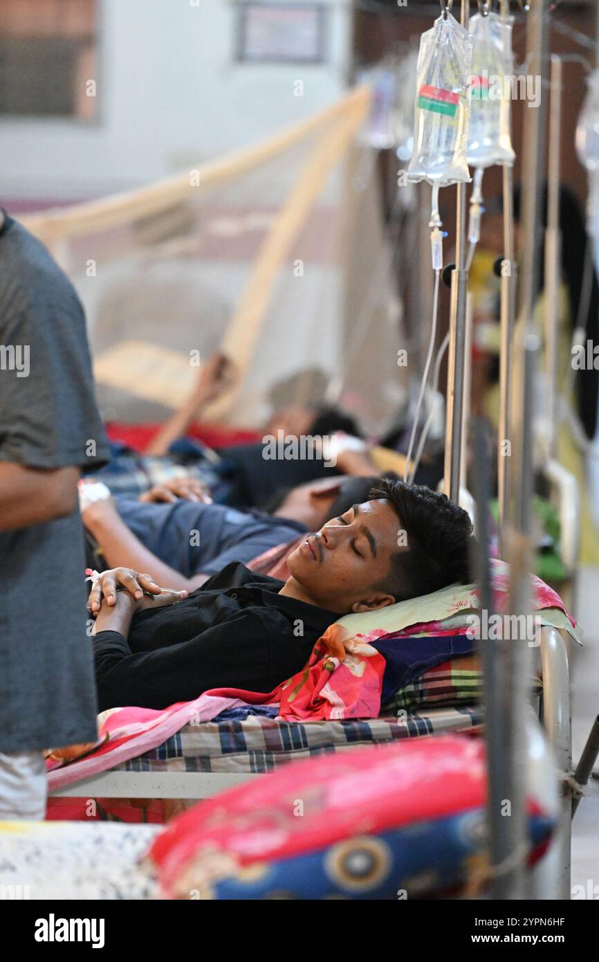 Patients suffering from dengue fever receive treatment inside the ...