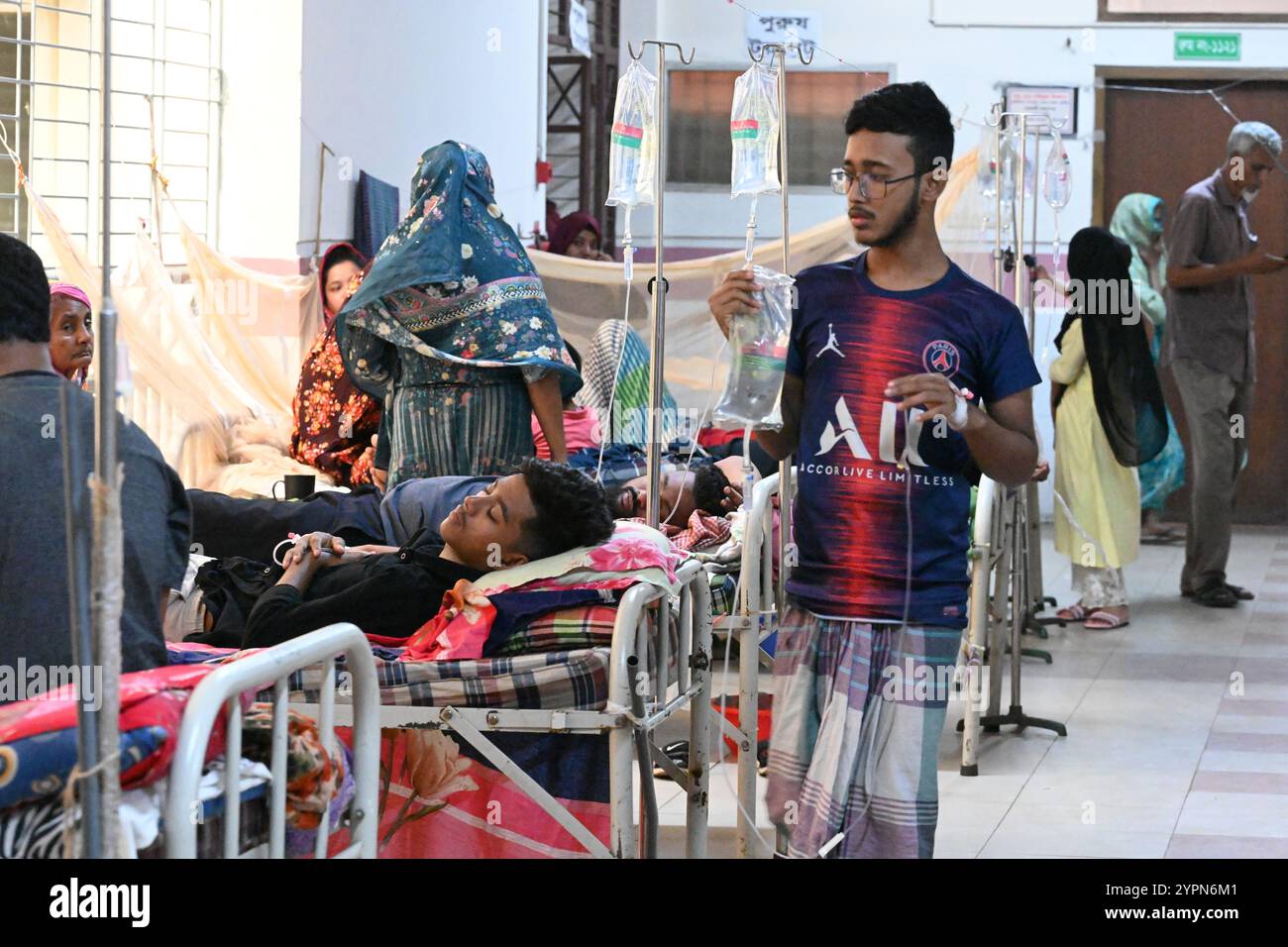 Patients suffering from dengue fever receive treatment inside the ...