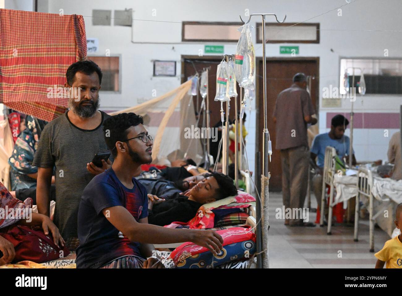 Patients suffering from dengue fever receive treatment inside the ...