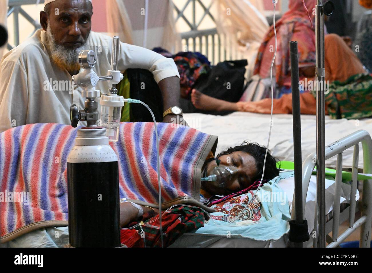 Patients suffering from dengue fever receive treatment inside the ...