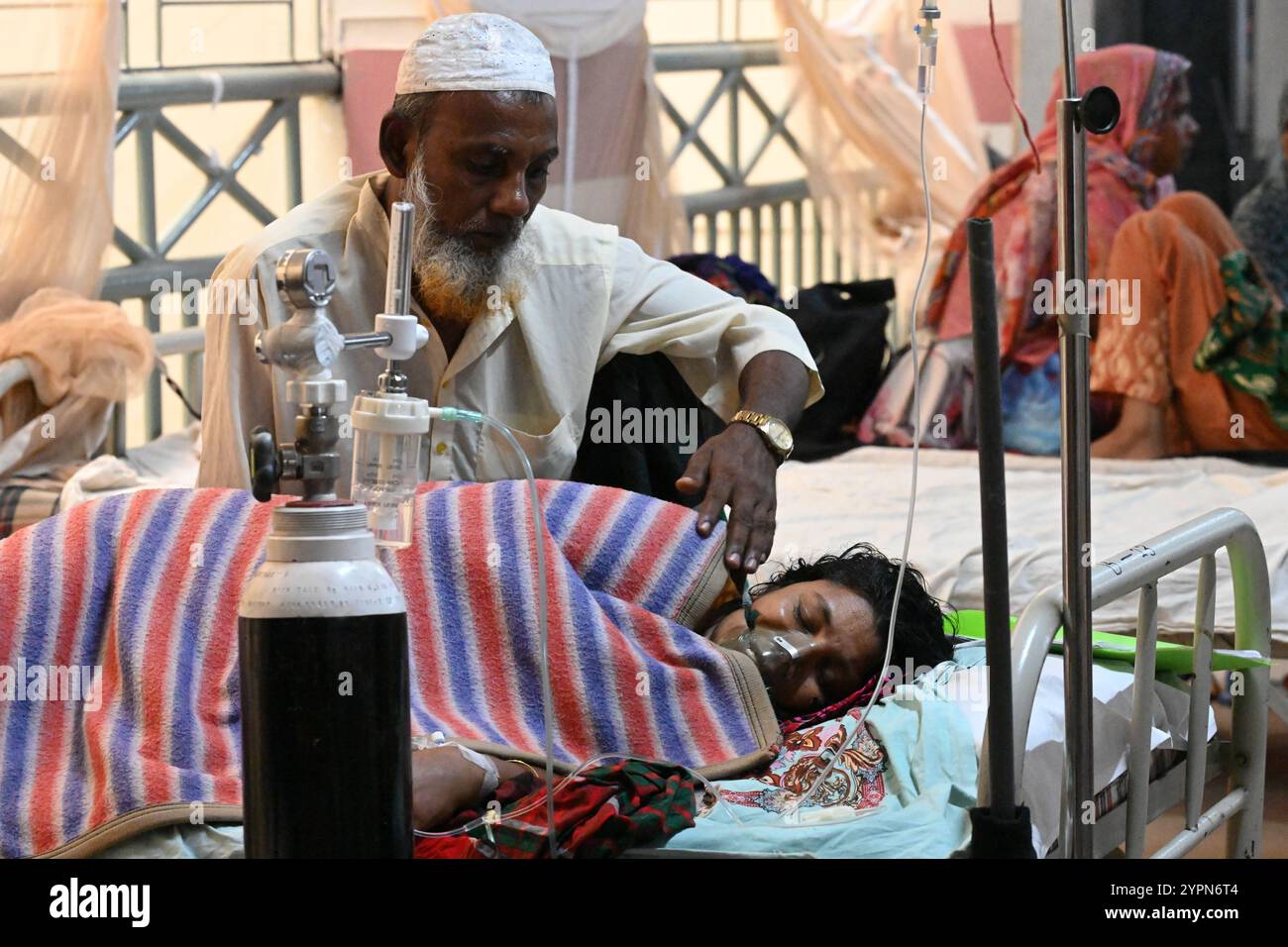 Patients suffering from dengue fever receive treatment inside the ...