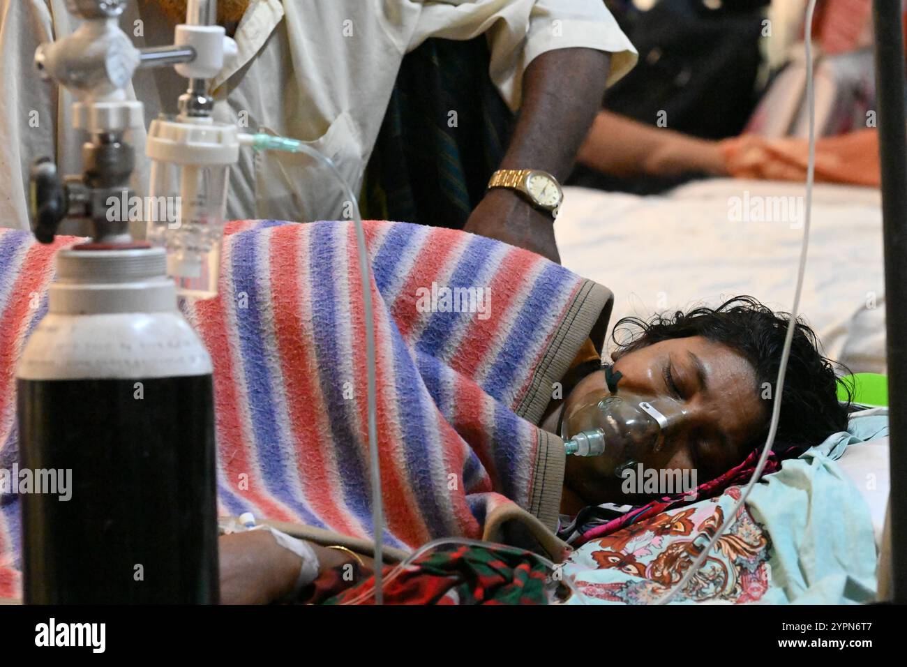 Patients suffering from dengue fever receive treatment inside the ...