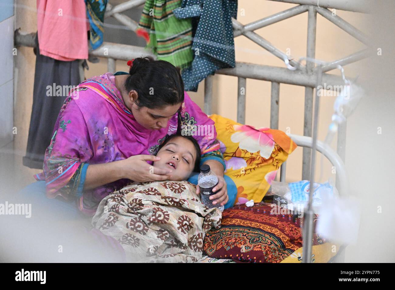 Patients suffering from dengue fever receive treatment inside the Mugdha General Hospital's ...