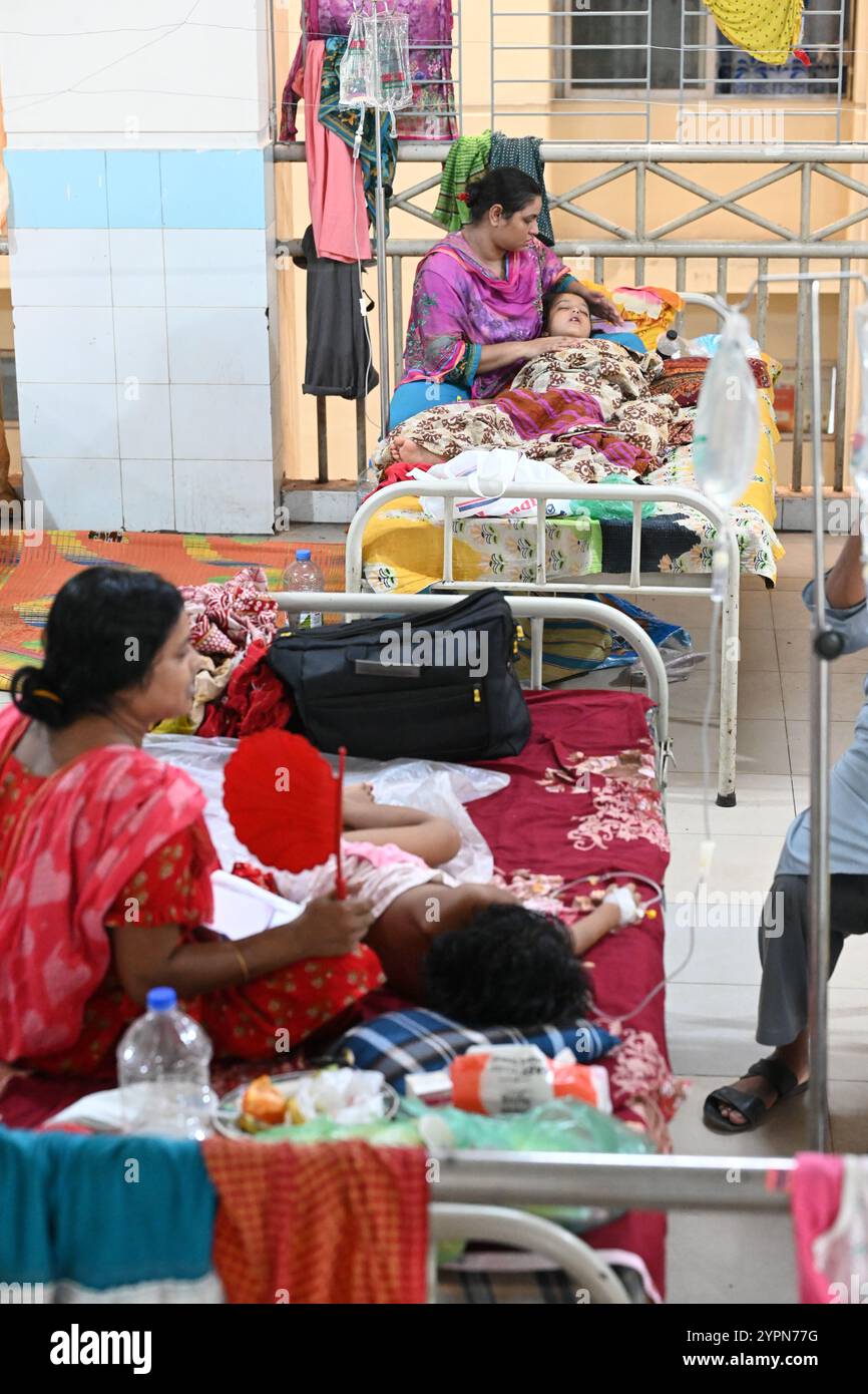 Patients suffering from dengue fever receive treatment inside the ...