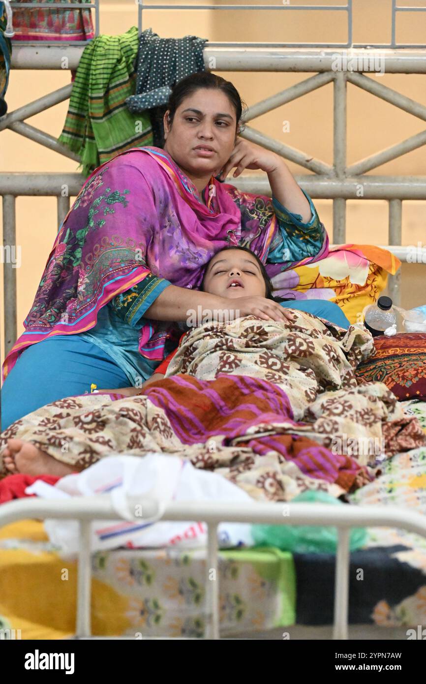 Patients suffering from dengue fever receive treatment inside the ...