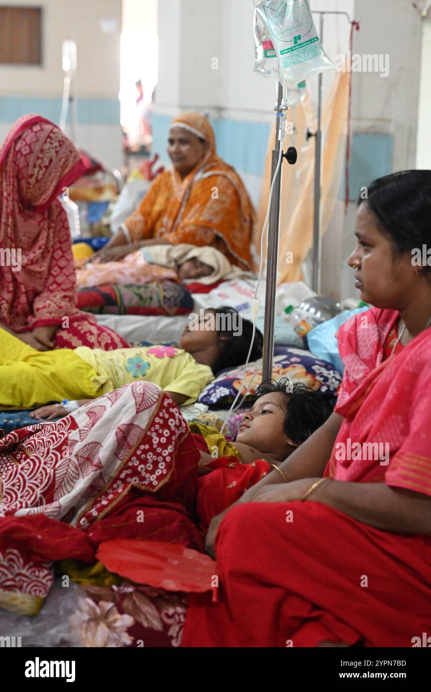 Patients suffering from dengue fever receive treatment inside the ...