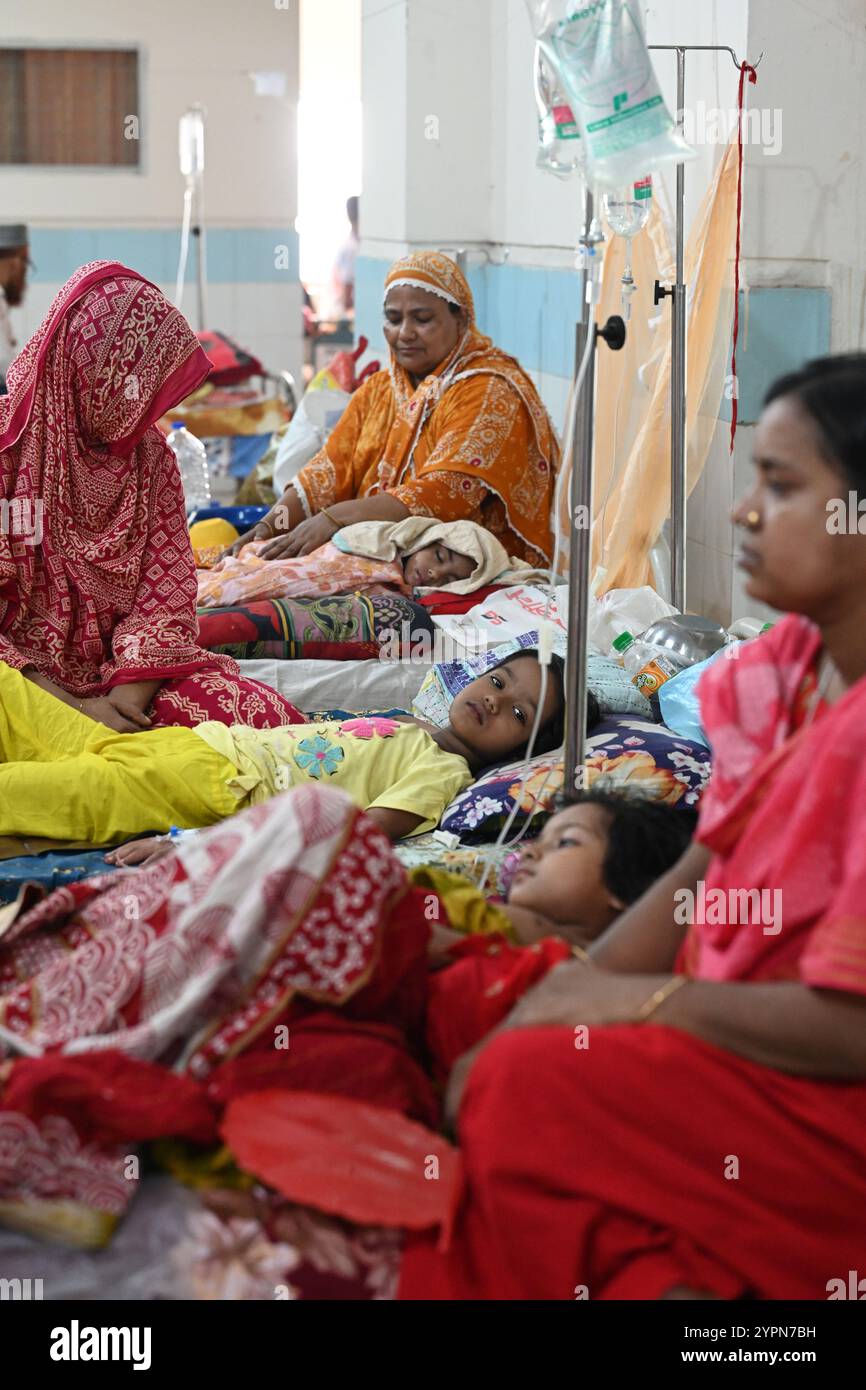 Patients suffering from dengue fever receive treatment inside the ...