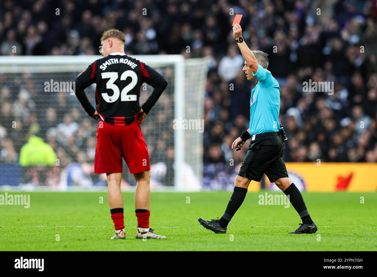 London, UK. 1st Dec, 2024. Referee Darren Bond shows a red card to Tom ...
