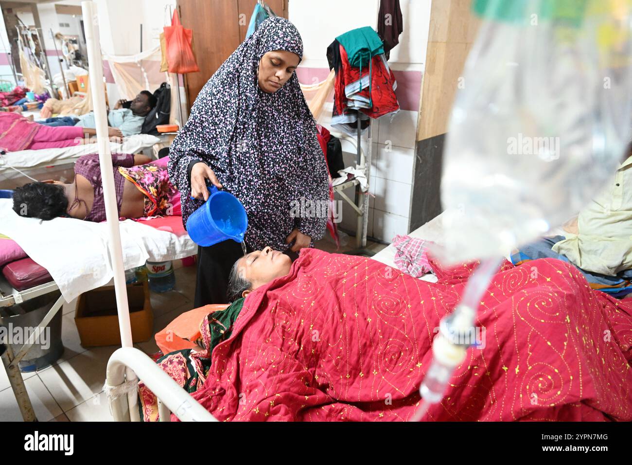 Patients suffering from dengue fever receive treatment inside the ...