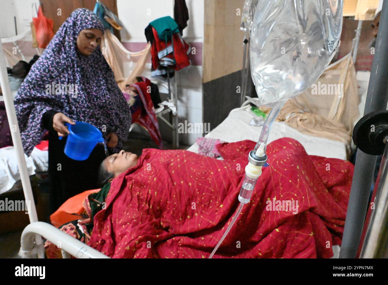 Patients suffering from dengue fever receive treatment inside the ...