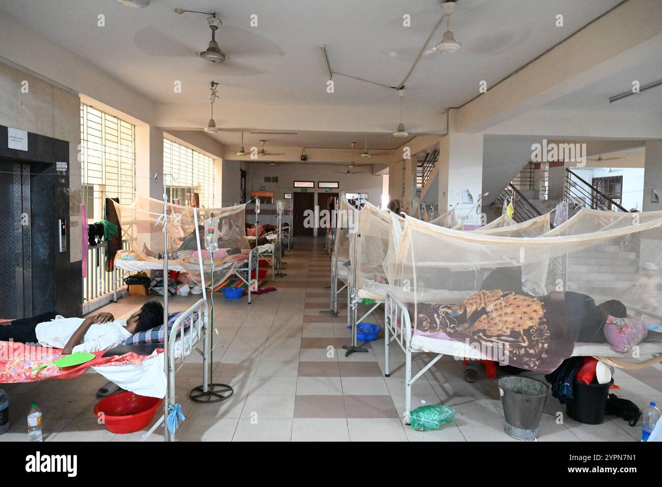 Patients suffering from dengue fever receive treatment inside the ...