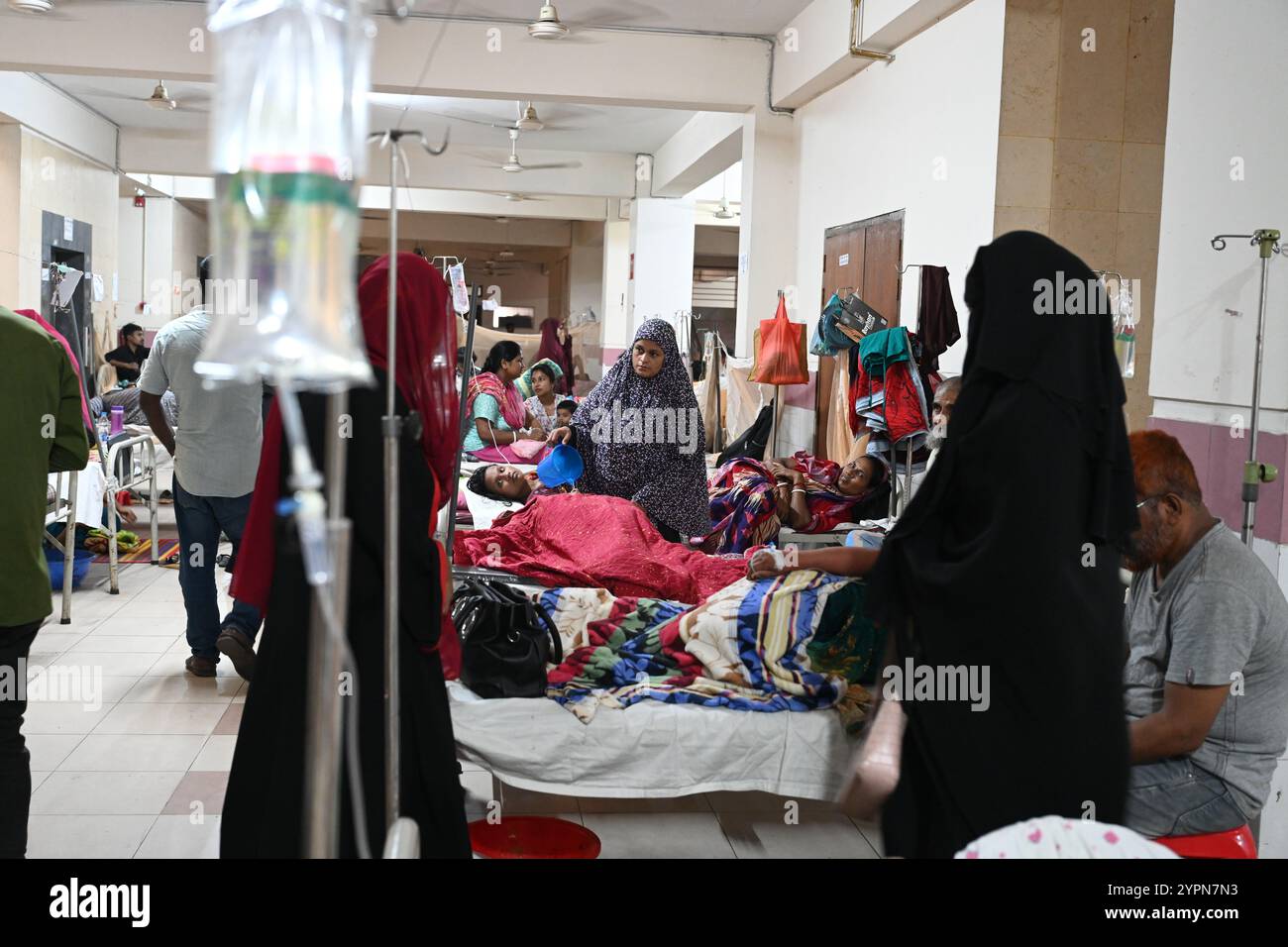 Patients suffering from dengue fever receive treatment inside the ...