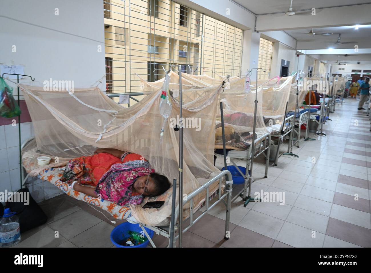 Patients suffering from dengue fever receive treatment inside the ...