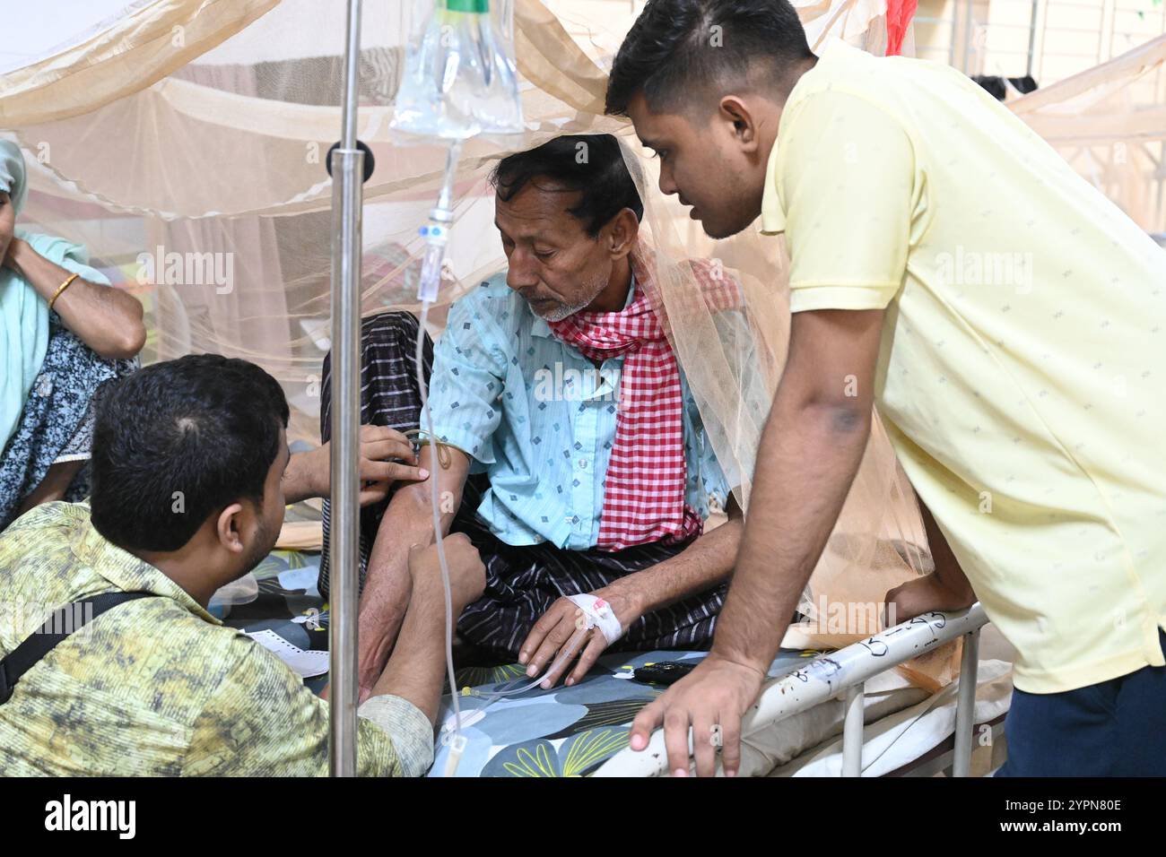 Patients suffering from dengue fever receive treatment inside the ...