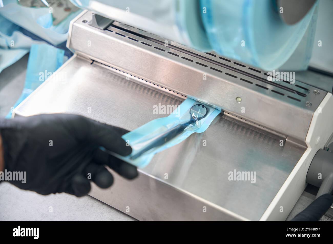 Dentist using equipment instruments close hi-res stock photography and ...