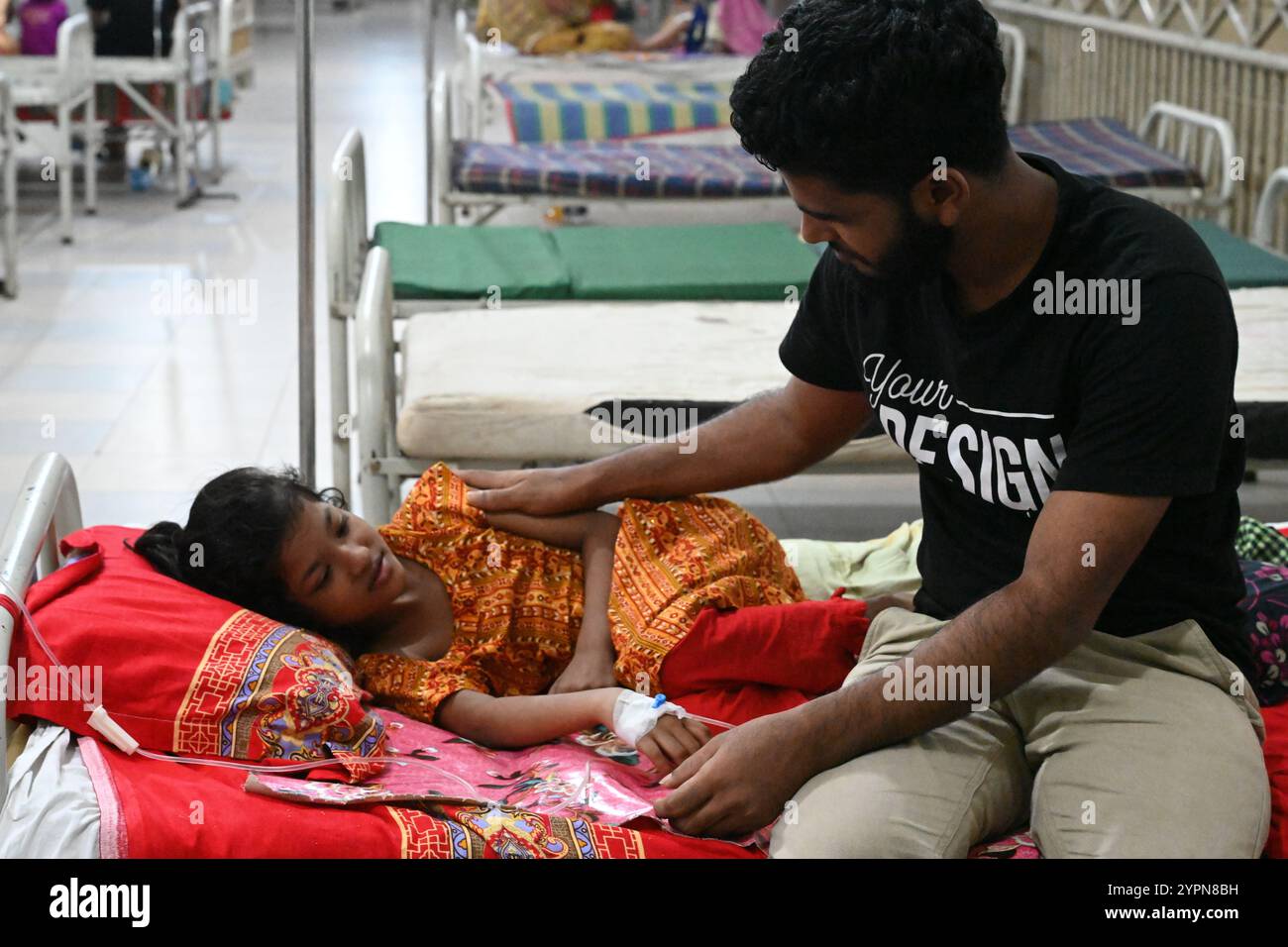 Patients suffering from dengue fever receive treatment inside the ...