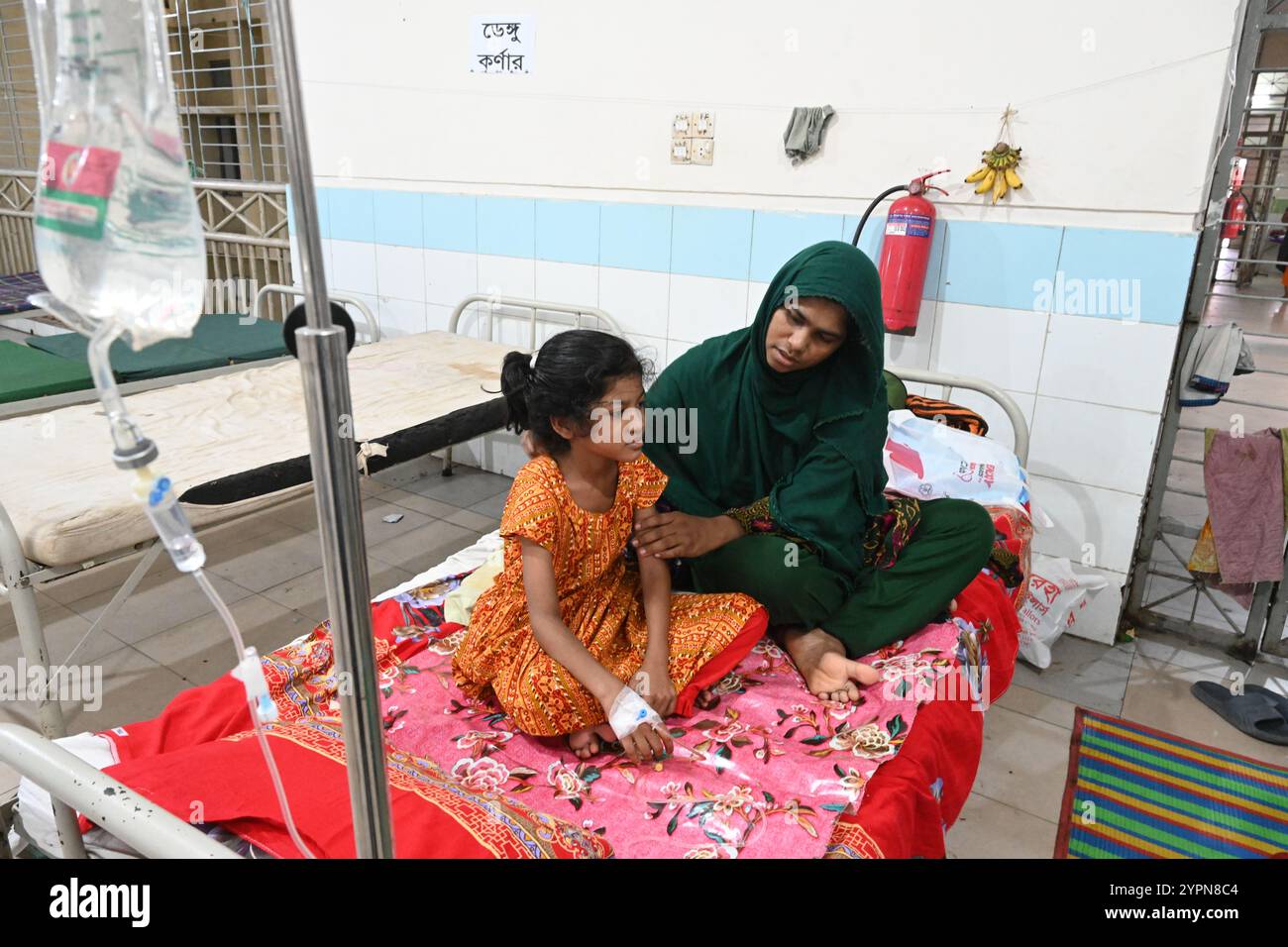 Patients suffering from dengue fever receive treatment inside the ...