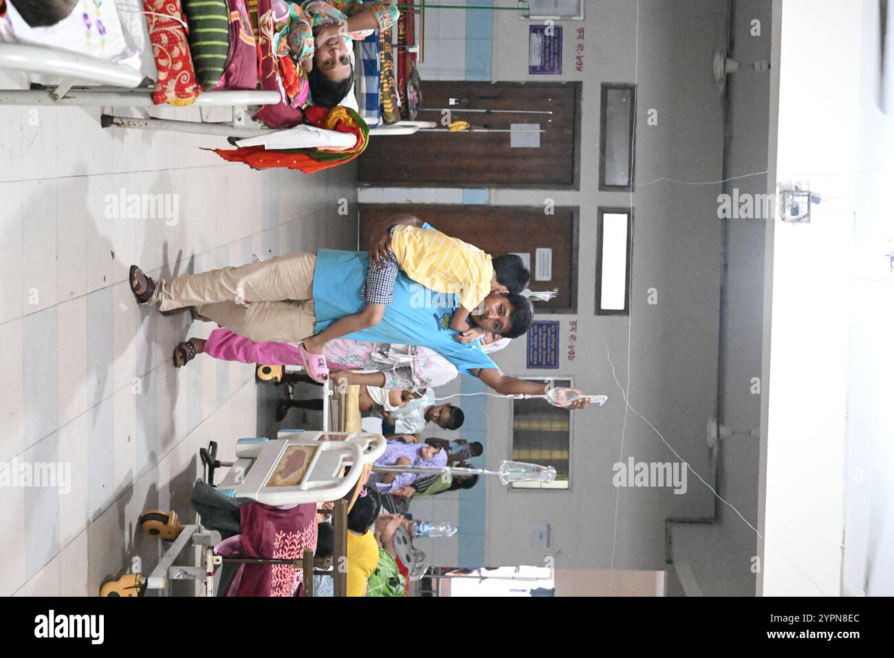 Patients suffering from dengue fever receive treatment inside the ...