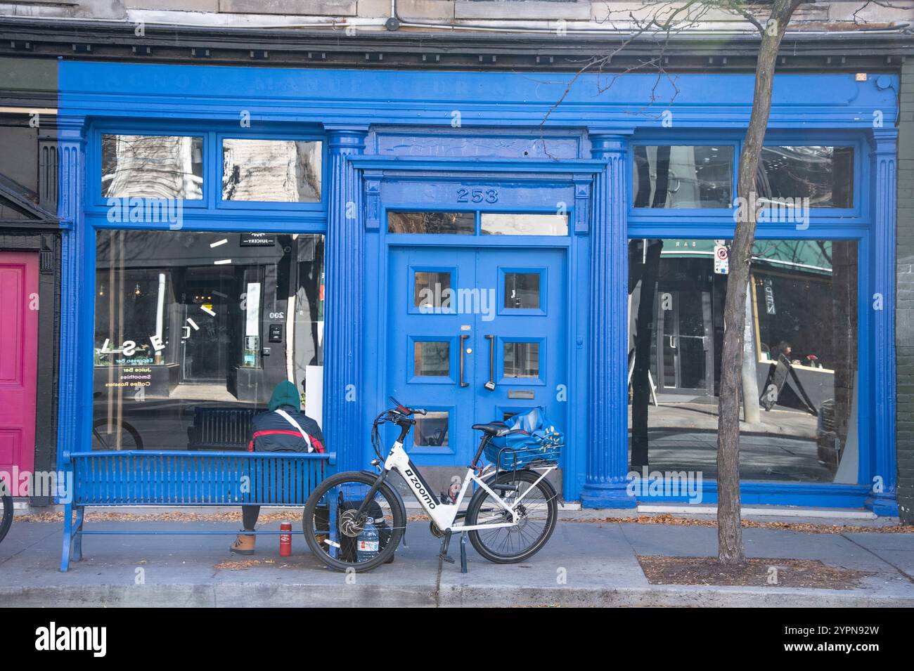 Blue front entrance and blue bench on Queen Street West in downtown ...