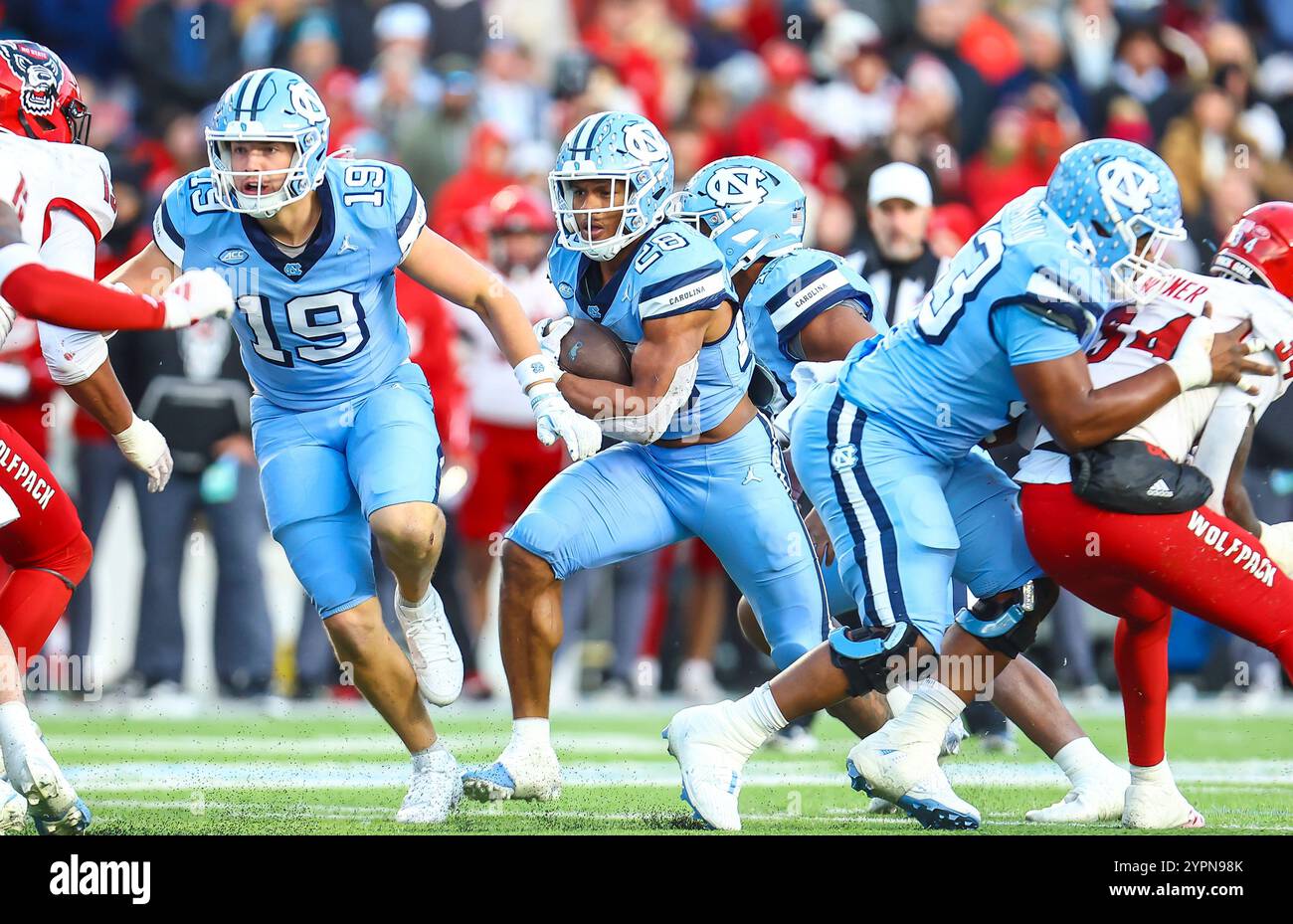 November 30, 2024: North Carolina junior Omarion Hampton (28) runs the ...