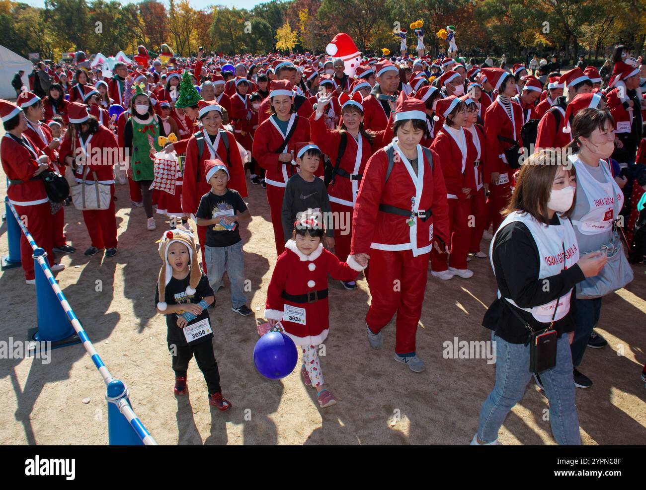 Participant dressed walk during the "Santa Parade Osaka 2024" at Osaka ...