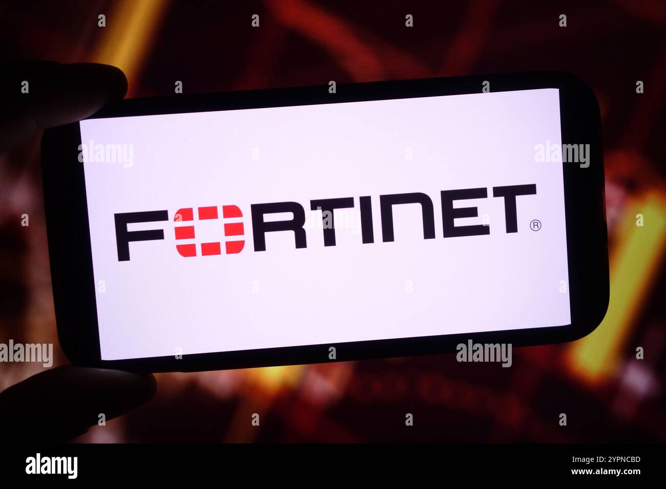 In this photo illustration, the Fortinet company logo is seen displayed ...