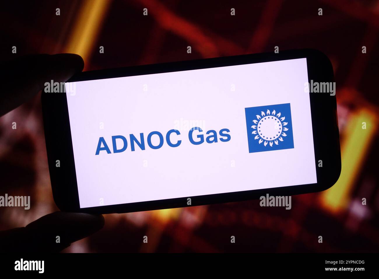 In this photo illustration, the ADNOC Gas company logo is seen ...