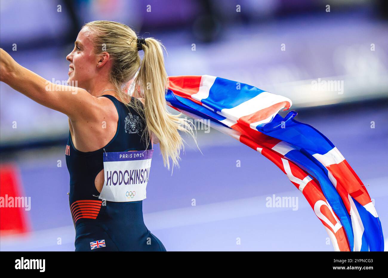 Keely Hodgkinson celebrating with her country's flag in the at the ...