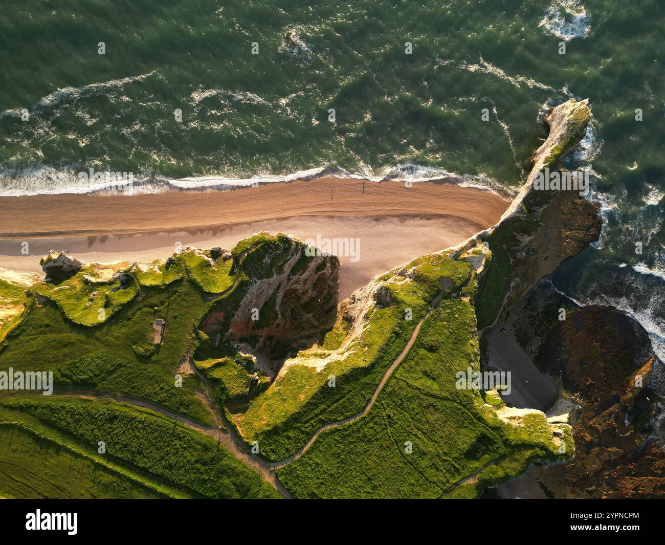 Aerial view of the famous white limestone cliffs near Etretat during ...