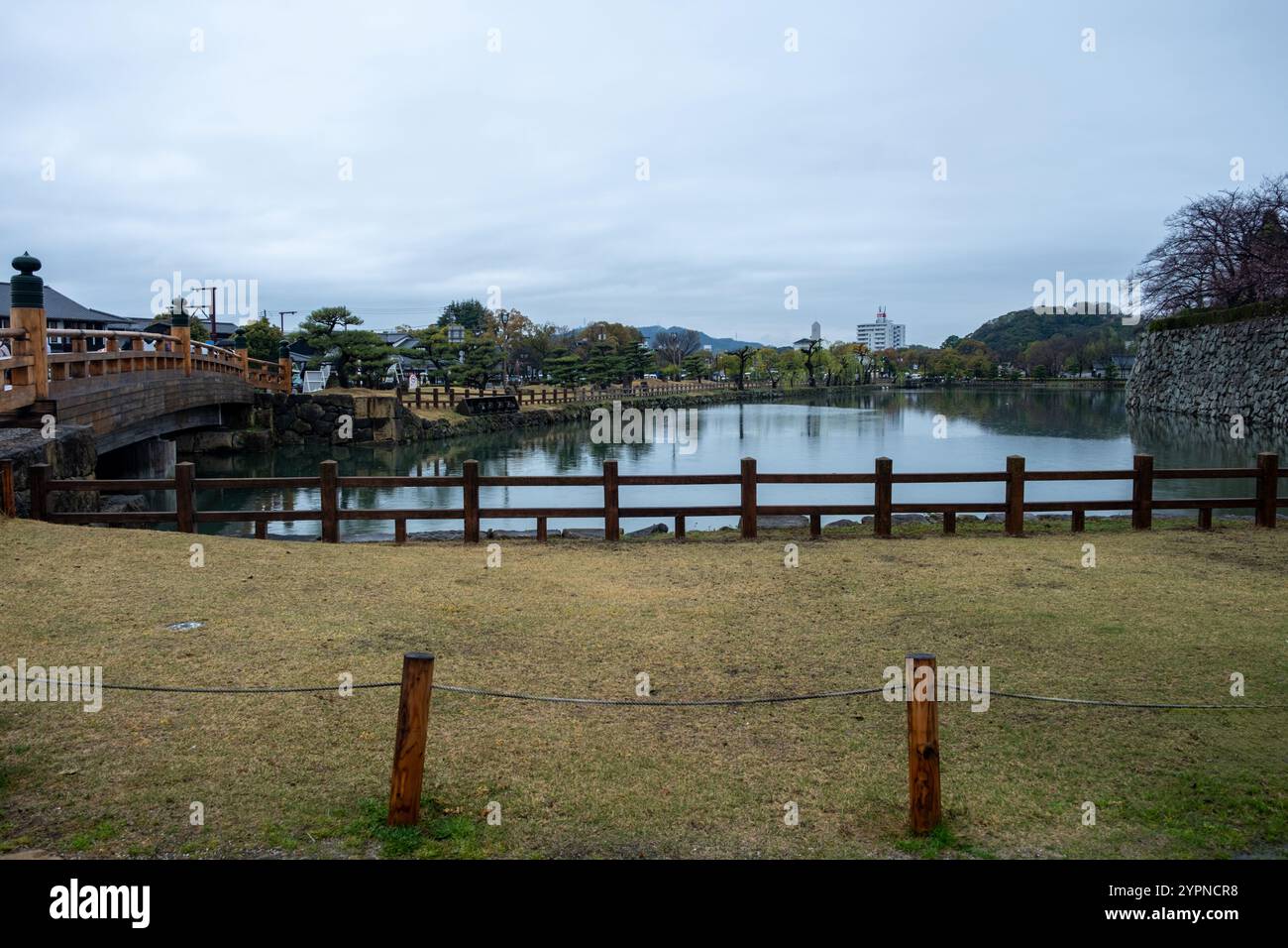 Japan, Sakuramon bridge and white Himeji castle moat, view from the ...
